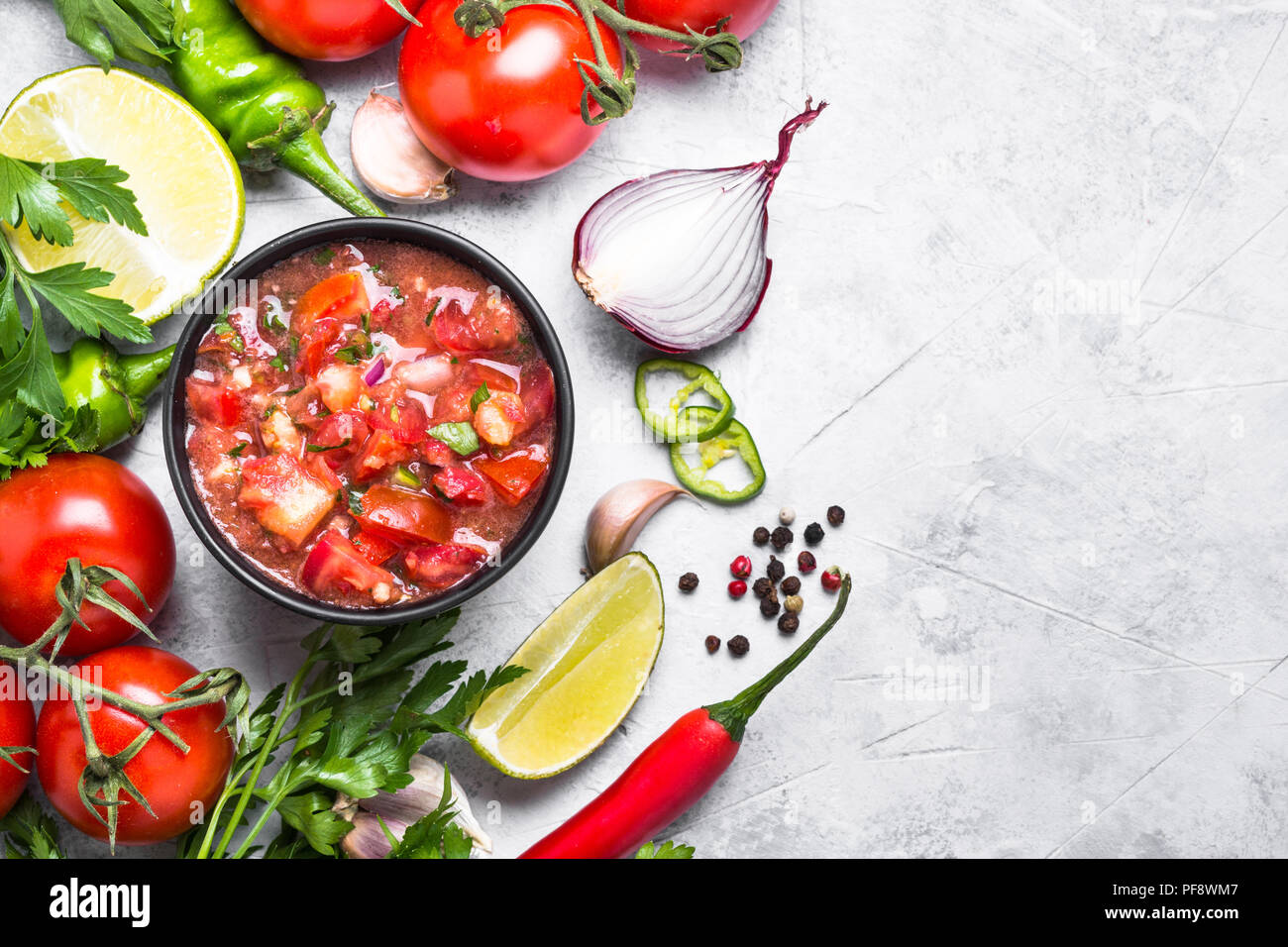 Salsa sauce and ingredients on stone table. Traditional Latin American ...