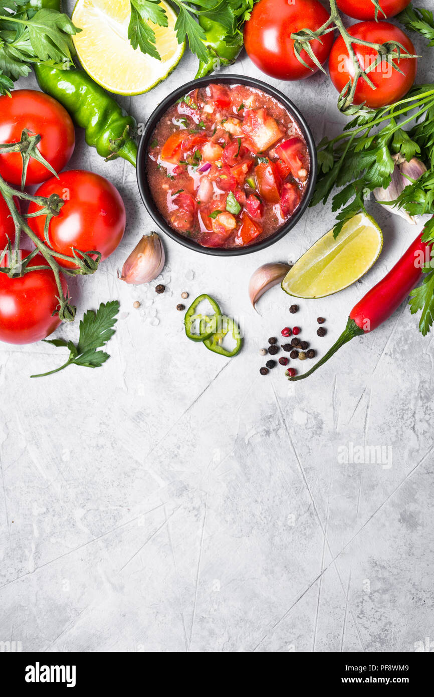 Traditional Latin American mexican salsa sauce and ingredients on stone ...