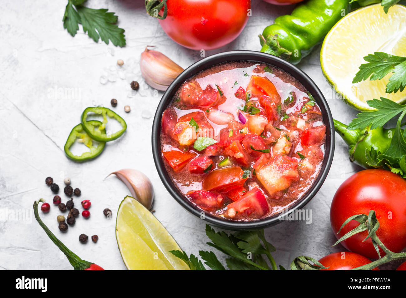 Salsa sauce and ingredients on stone table. Traditional Latin American ...
