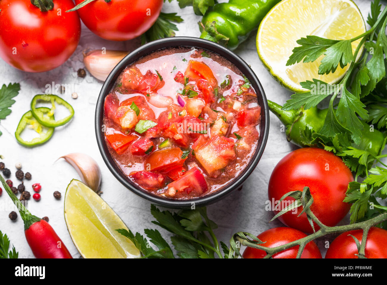 Traditional Latin American mexican salsa sauce and ingredients on stone ...