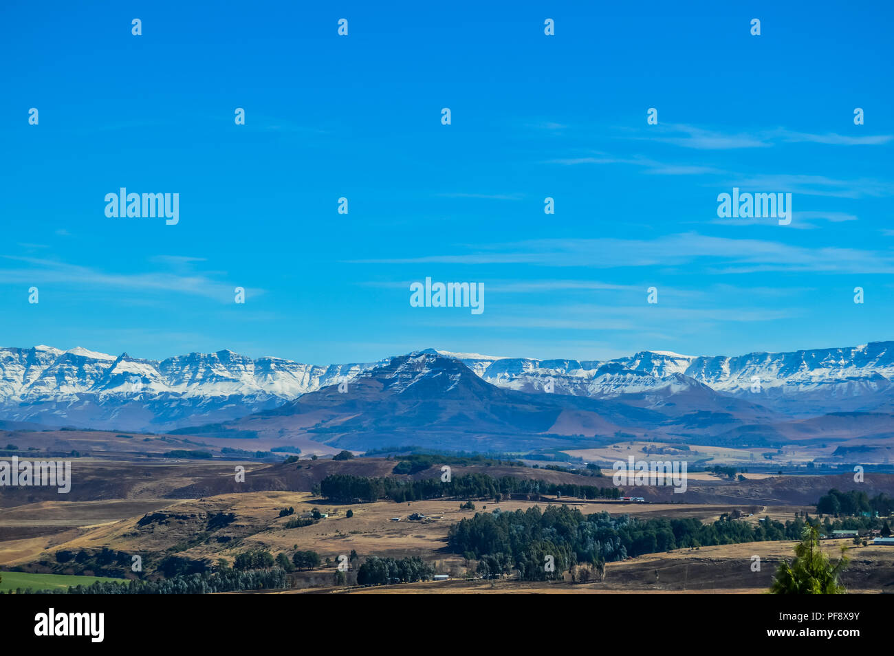 Landscape of Underberg , a small countryside village with snow clad ...