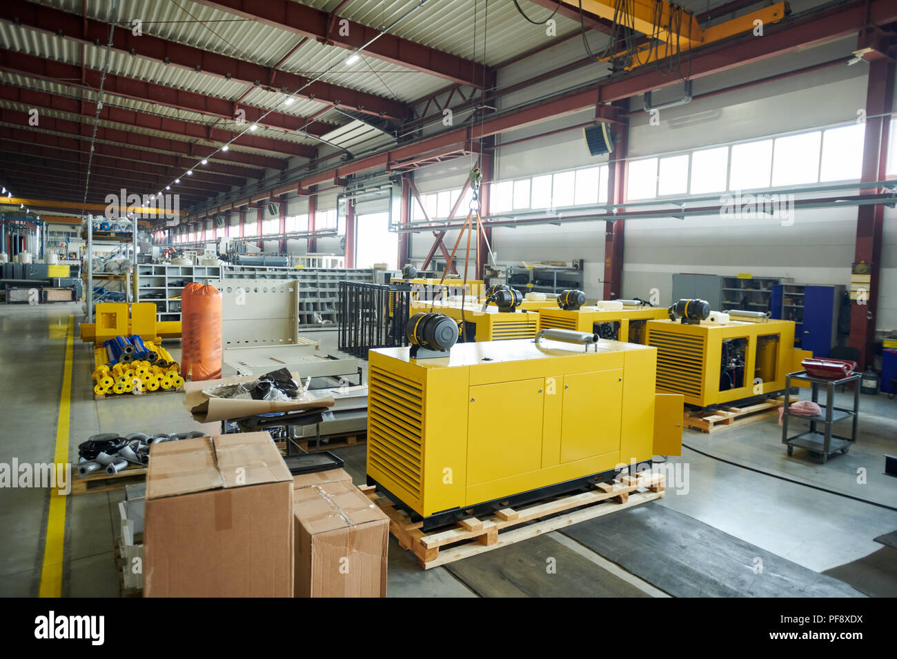 Background shot of empty factory workshop with machine parts ready for ...