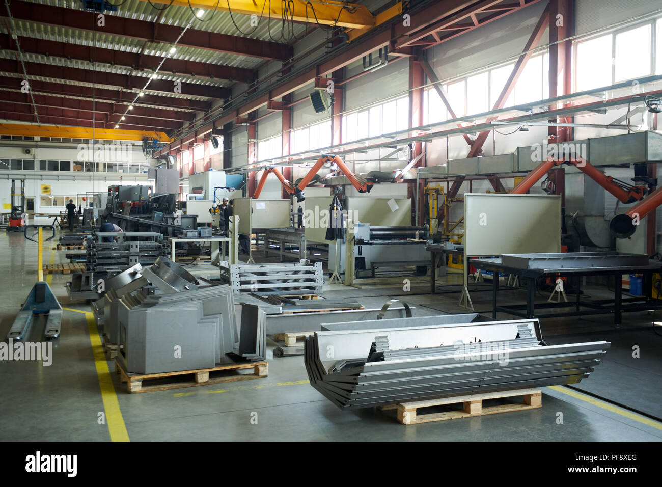 Wide angle background shot of empty factory workshop with machines ...