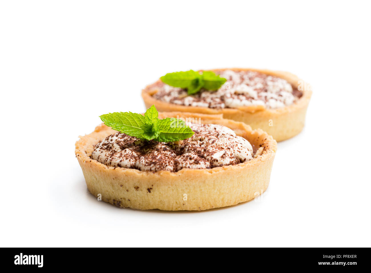 Mini banoffee pie tarts isolated on white Stock Photo - Alamy