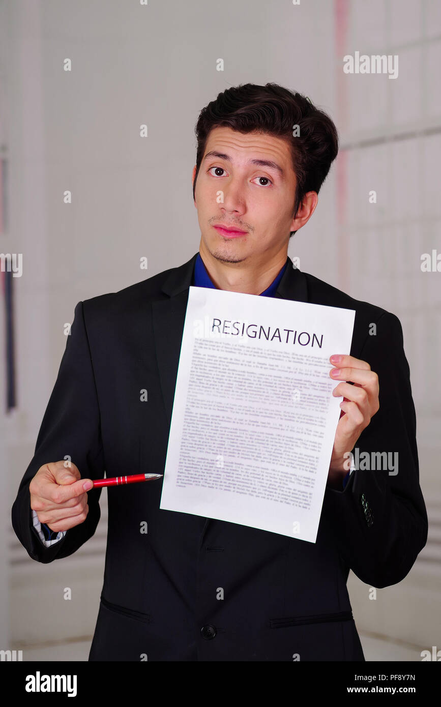 Close up of boss wearing a suit and giving a sheet of paper of ...