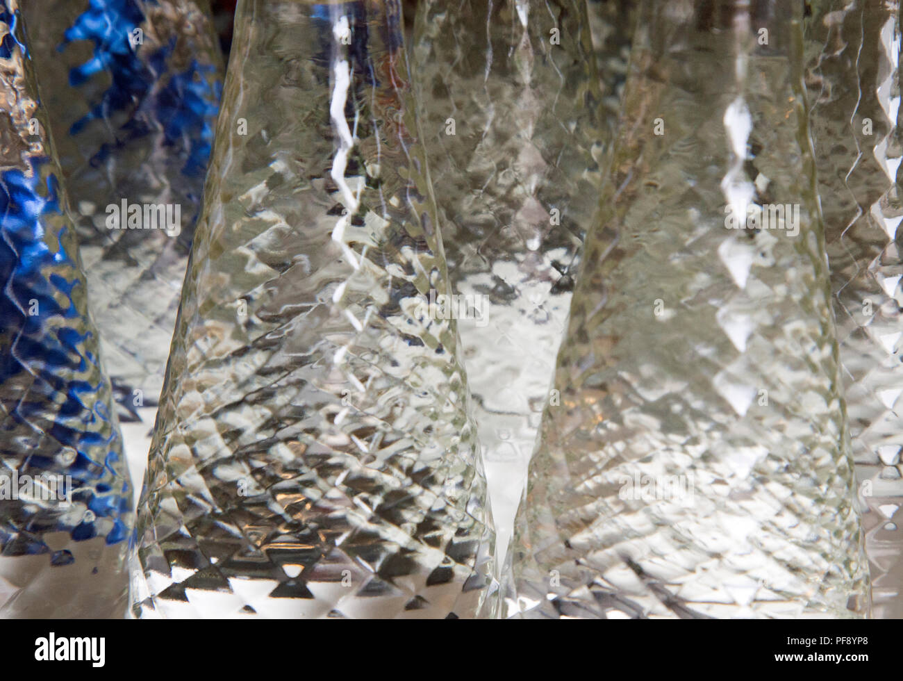 Patterned glass bottles shot close up Stock Photo - Alamy