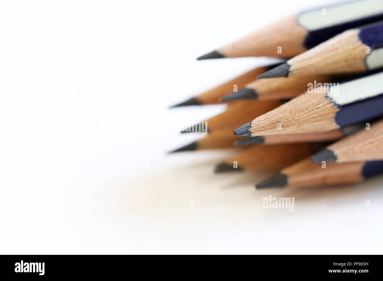Arrangement of close up sharpened drawing writing graphite pencils ...