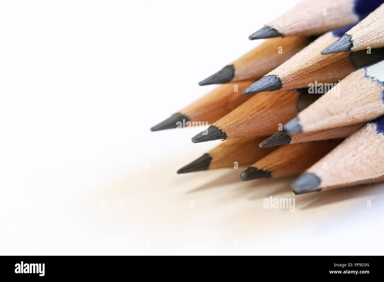 Arrangement of close up sharpened drawing writing graphite pencils ...