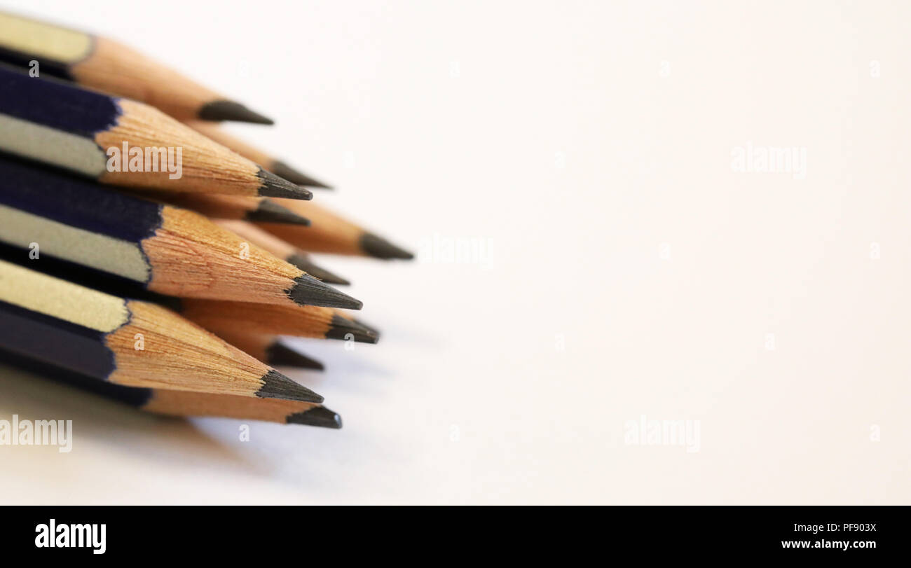Arrangement of close up sharpened drawing writing graphite pencils ...