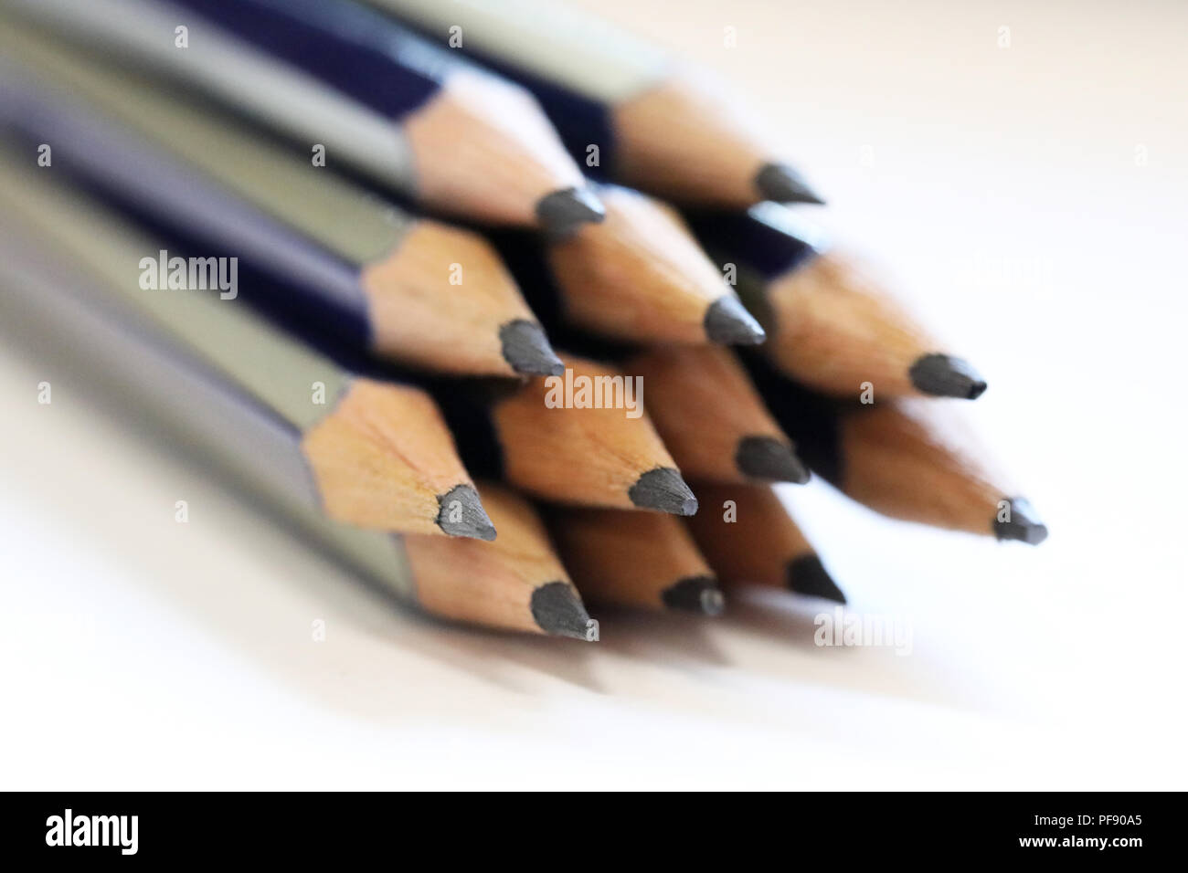 Arrangement of close up sharpened drawing writing graphite pencils ...