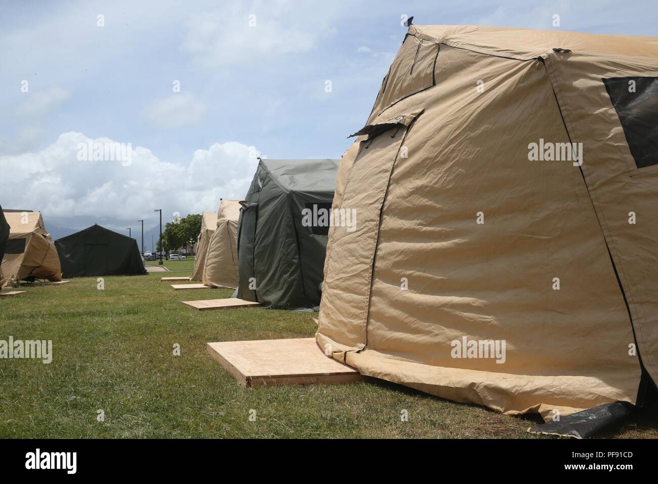 U.S. Marines with 1st Battalion, 3rd Marine Regiment, set up tents at ...