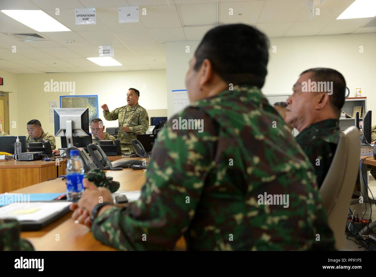 U.S. Army Lt. Col. Jon Ishakawa, J3 director assigned to Joint Task 5-0, gives a briefing during ...