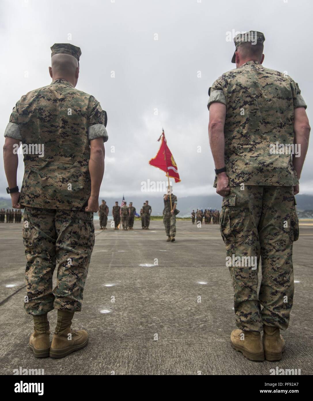 U.S. Marine Corps Lt. Col. Peter Ban and Lt. Col. Kenneth Phelps wait ...
