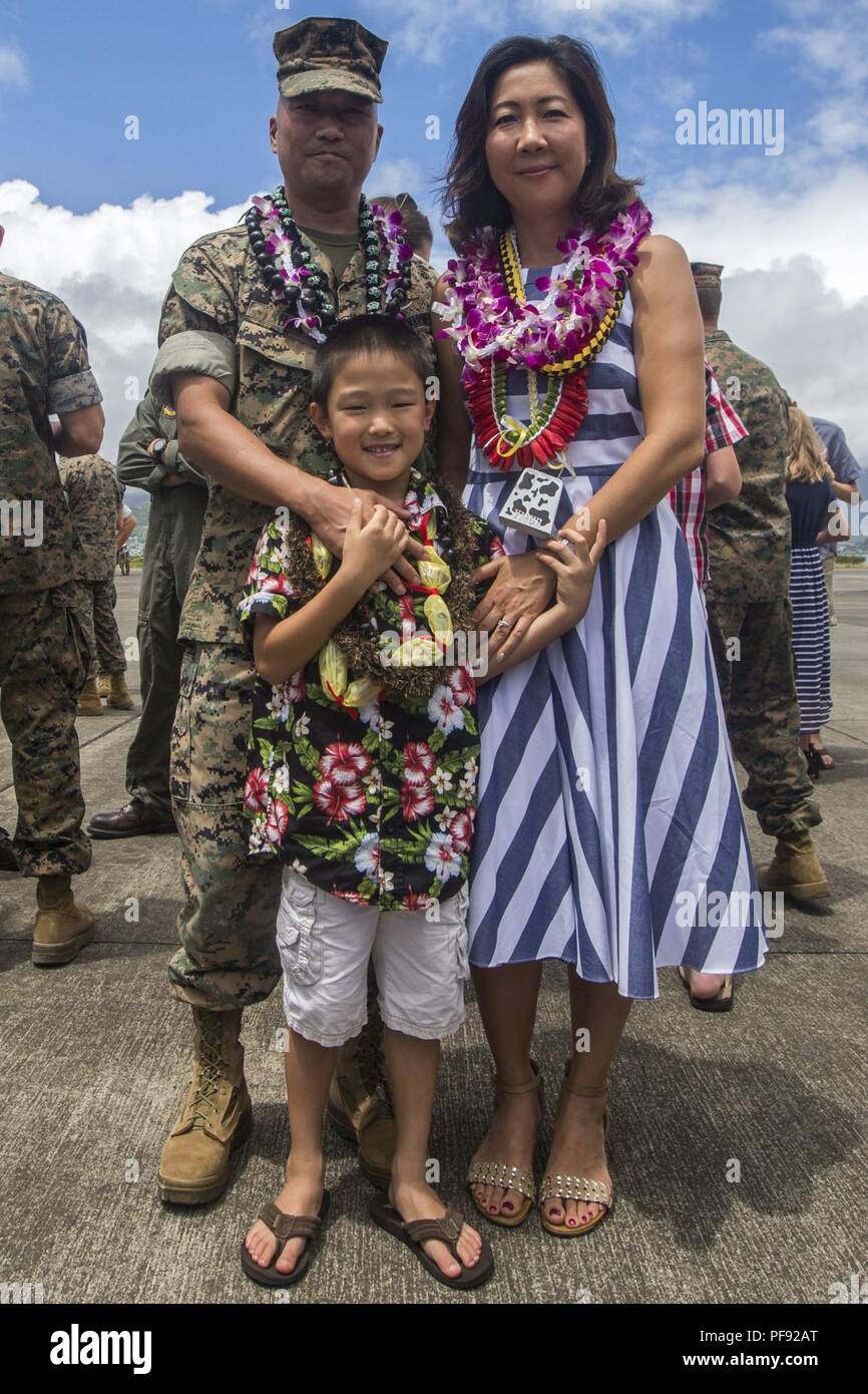 U.S. Marine Corps Lt. Col. Peter Ban and his family pose for a photo ...