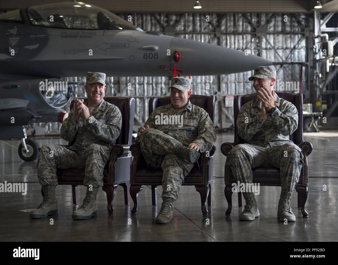 U.S. Air Force Col. Thomas Schramel, the 35th Maintenance Group commander, administers a change ...