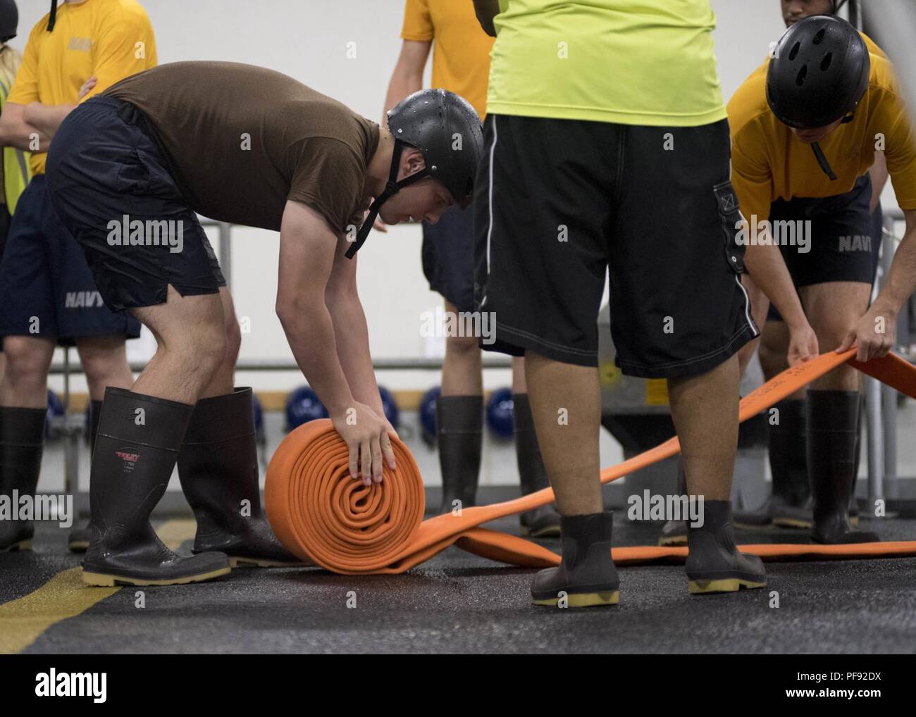 NEWPORT, R.I. (June 7, 2018) Naval ROTC Midshipmen stow gear after a ...