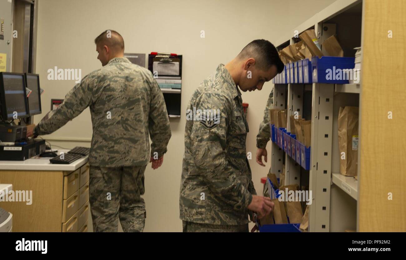 Members of the 18th Medical Group process prescriptions at the pharmacy ...