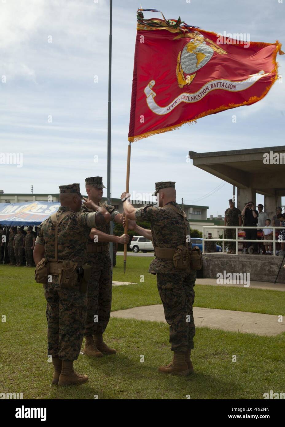 CAMP HANSEN, OKINAWA, Japan – Lt. Col. Thomas B. McGee passes colors ...