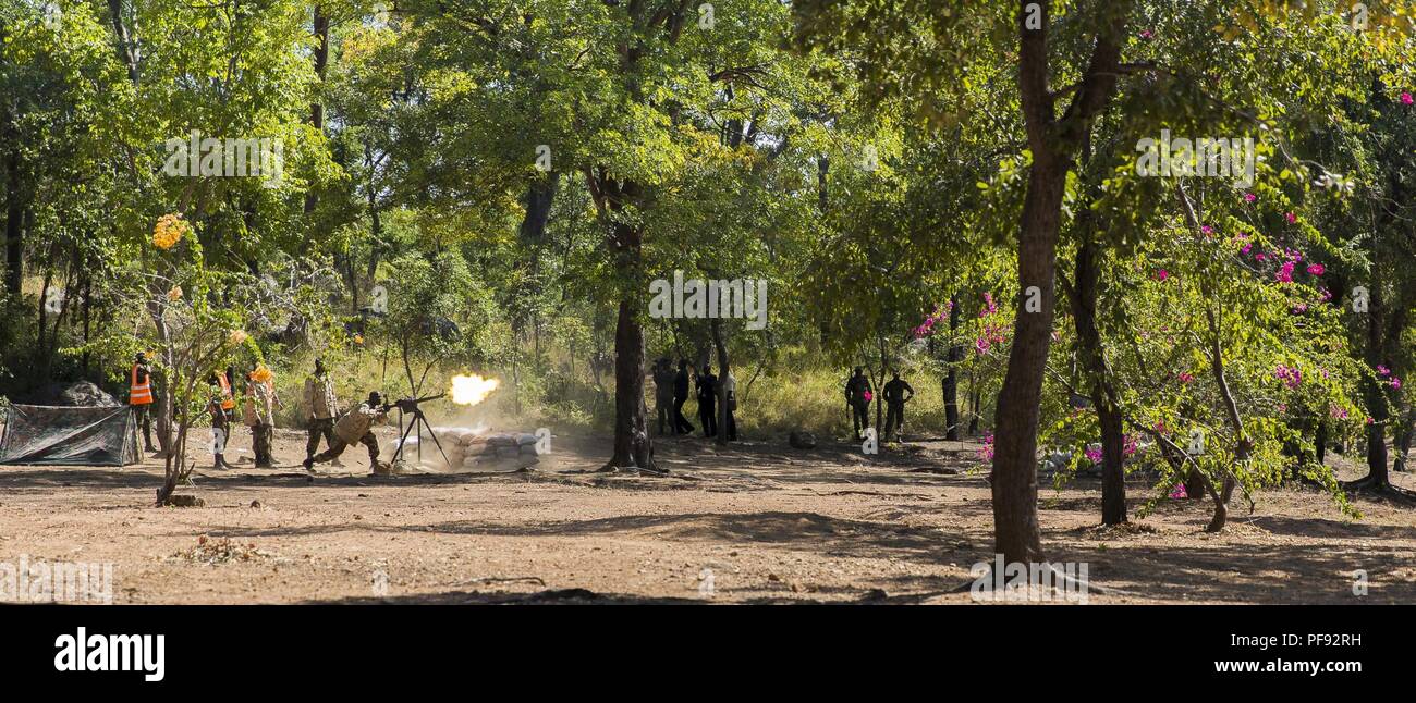 A Malawi Defence Force soldier lays down suppressive fire for his ...