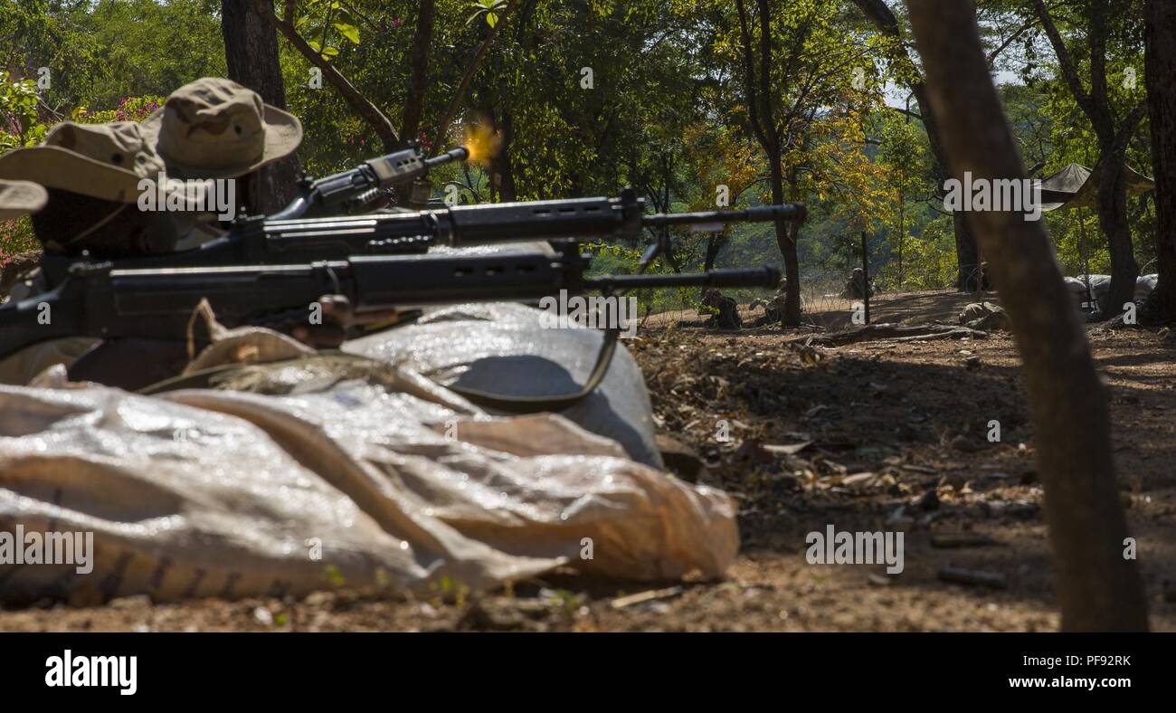 A Malawi Defence Force fire team takes cover at a defensive fighting ...
