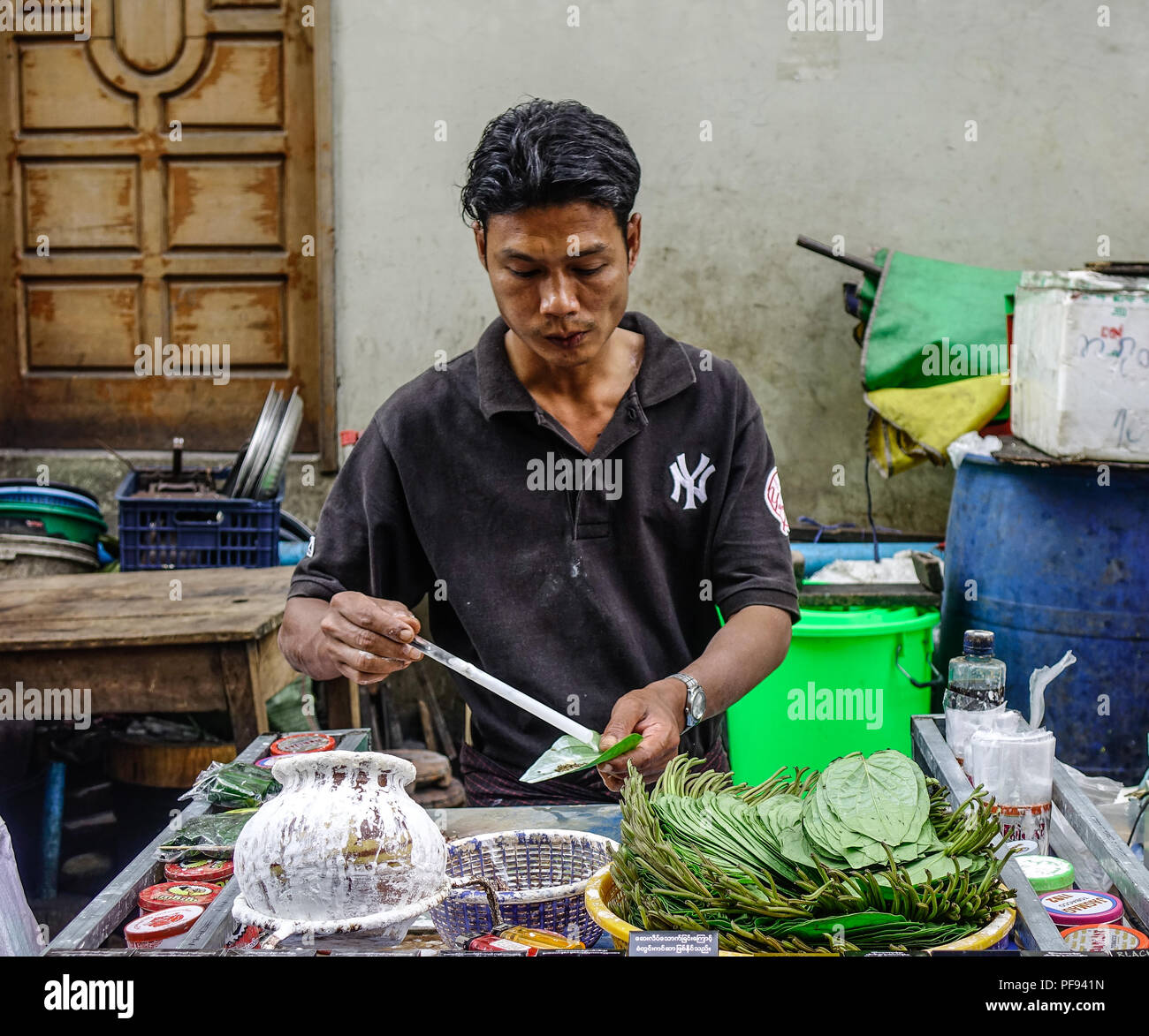 Yangon, Myanmar - Feb 1, 2017. Selling betel leaf at market in Yangon ...