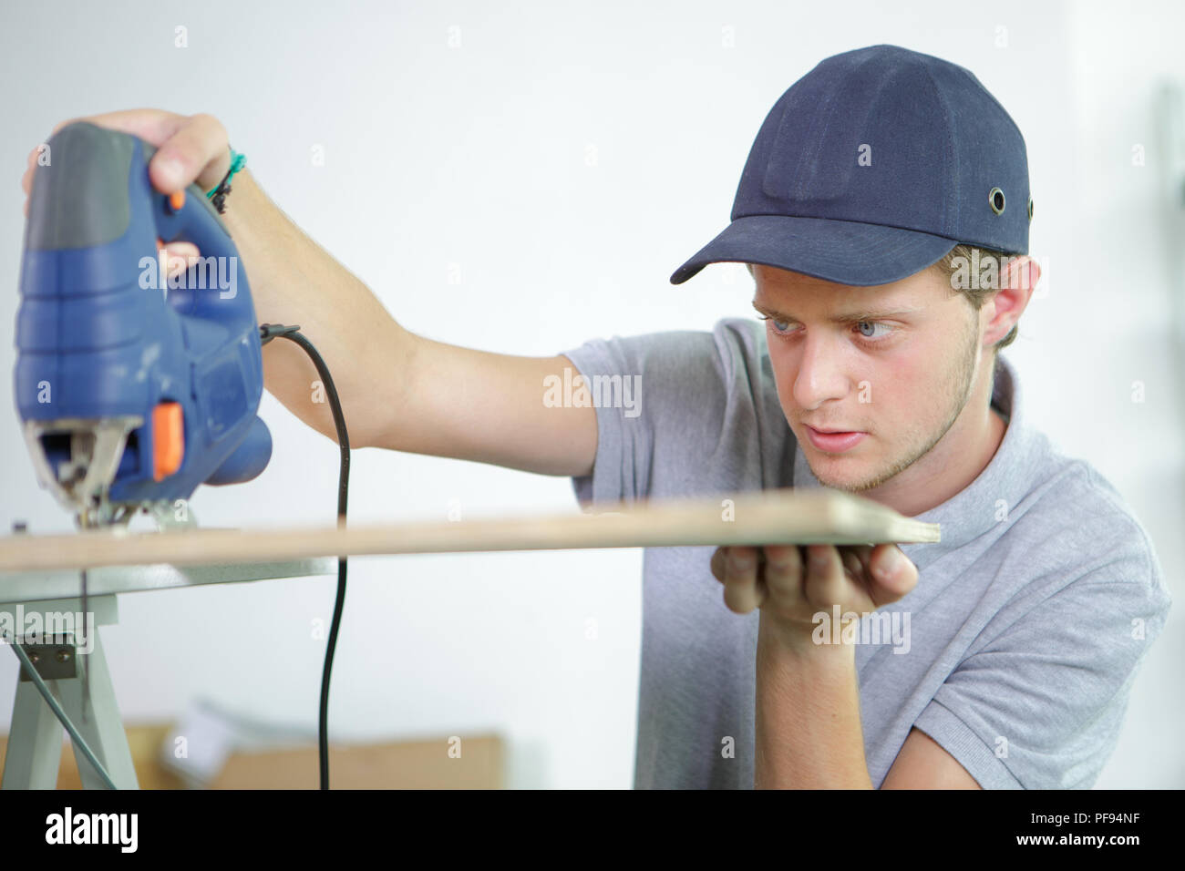 Man using electric jigsaw cut hi-res stock photography and images - Alamy