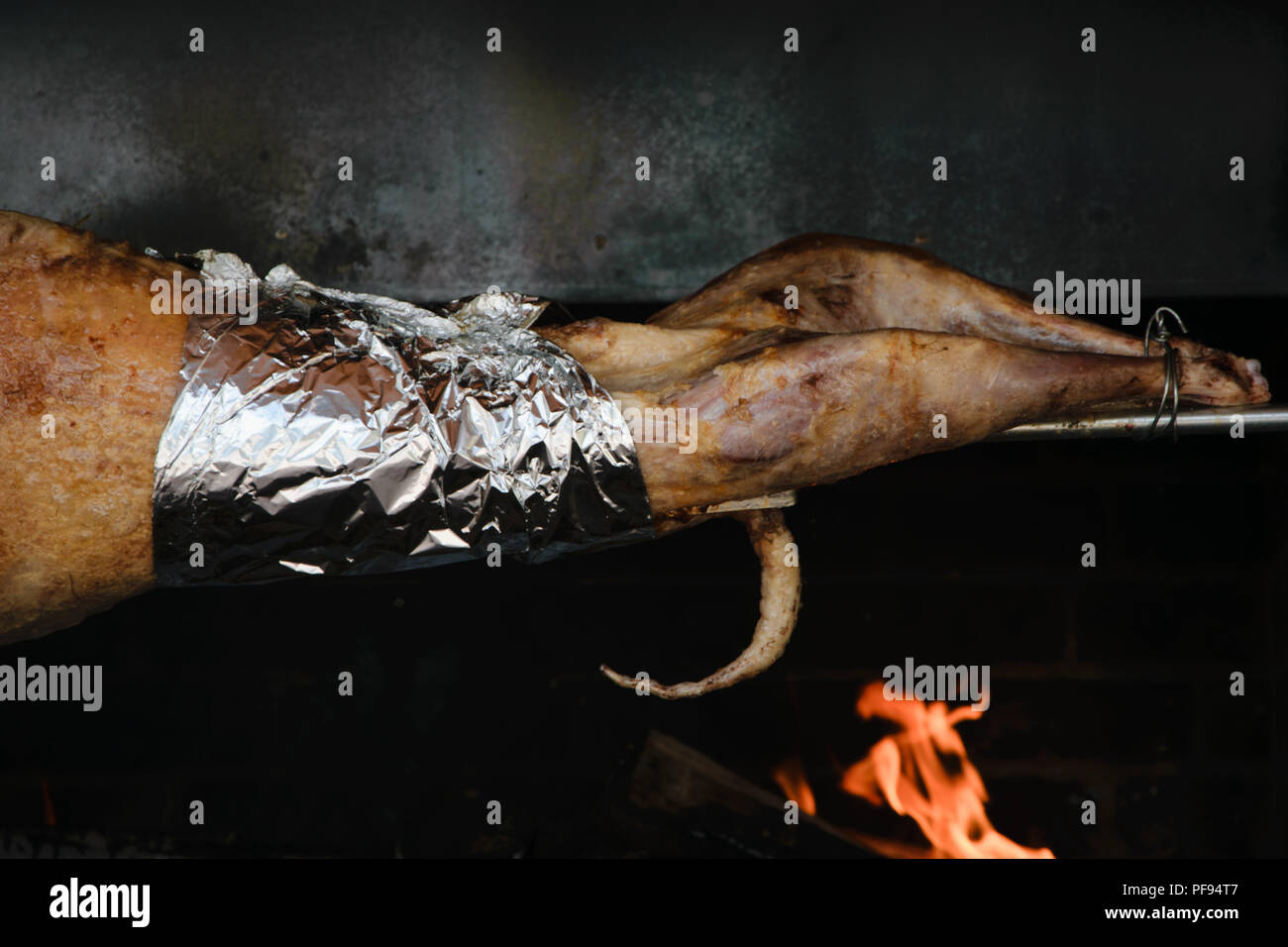 Traditional way of cooking a whole animal (lamb, goat) - roasting an ...
