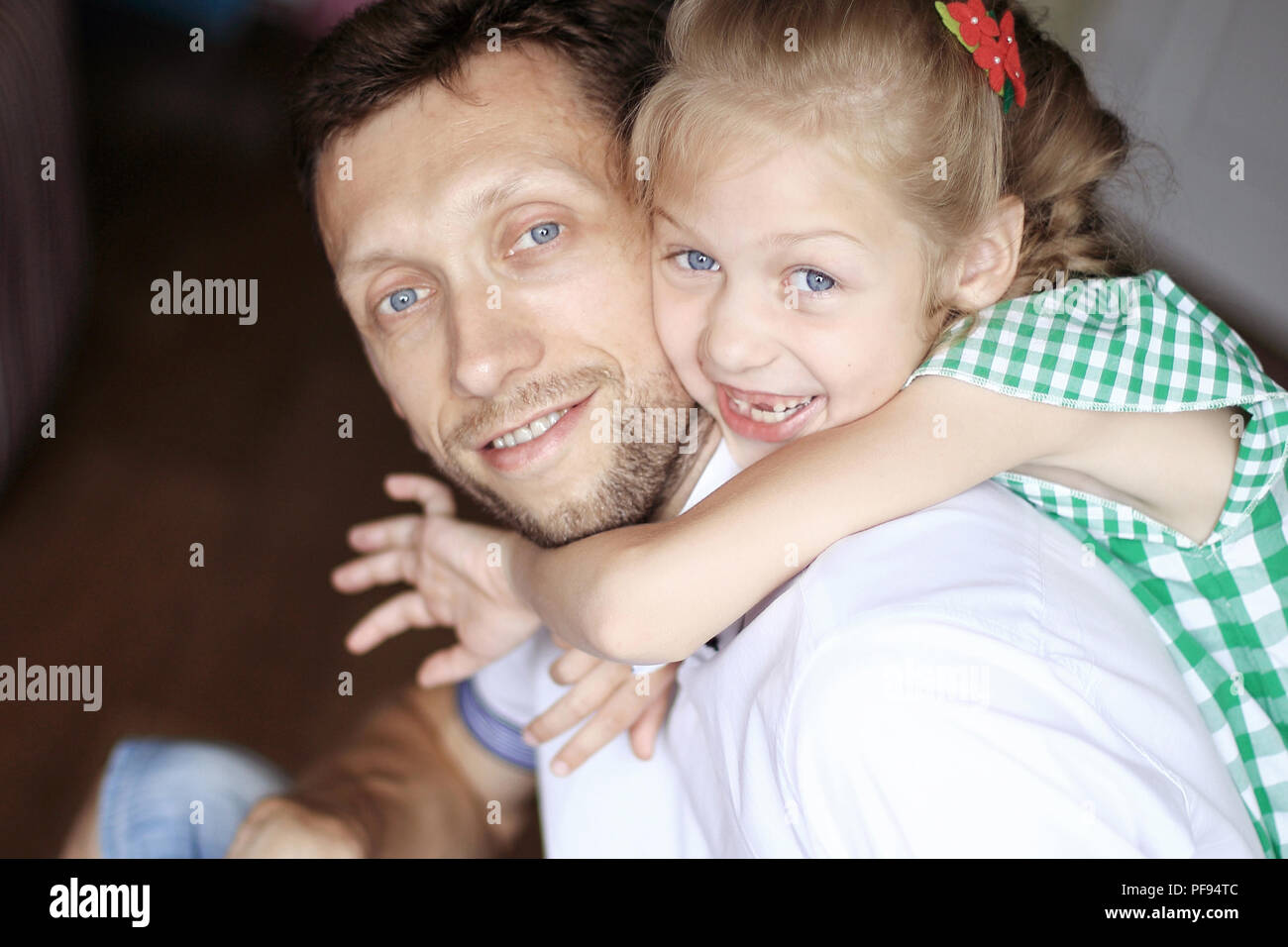 concept of raising children - a little girl hugging her beloved Stock ...