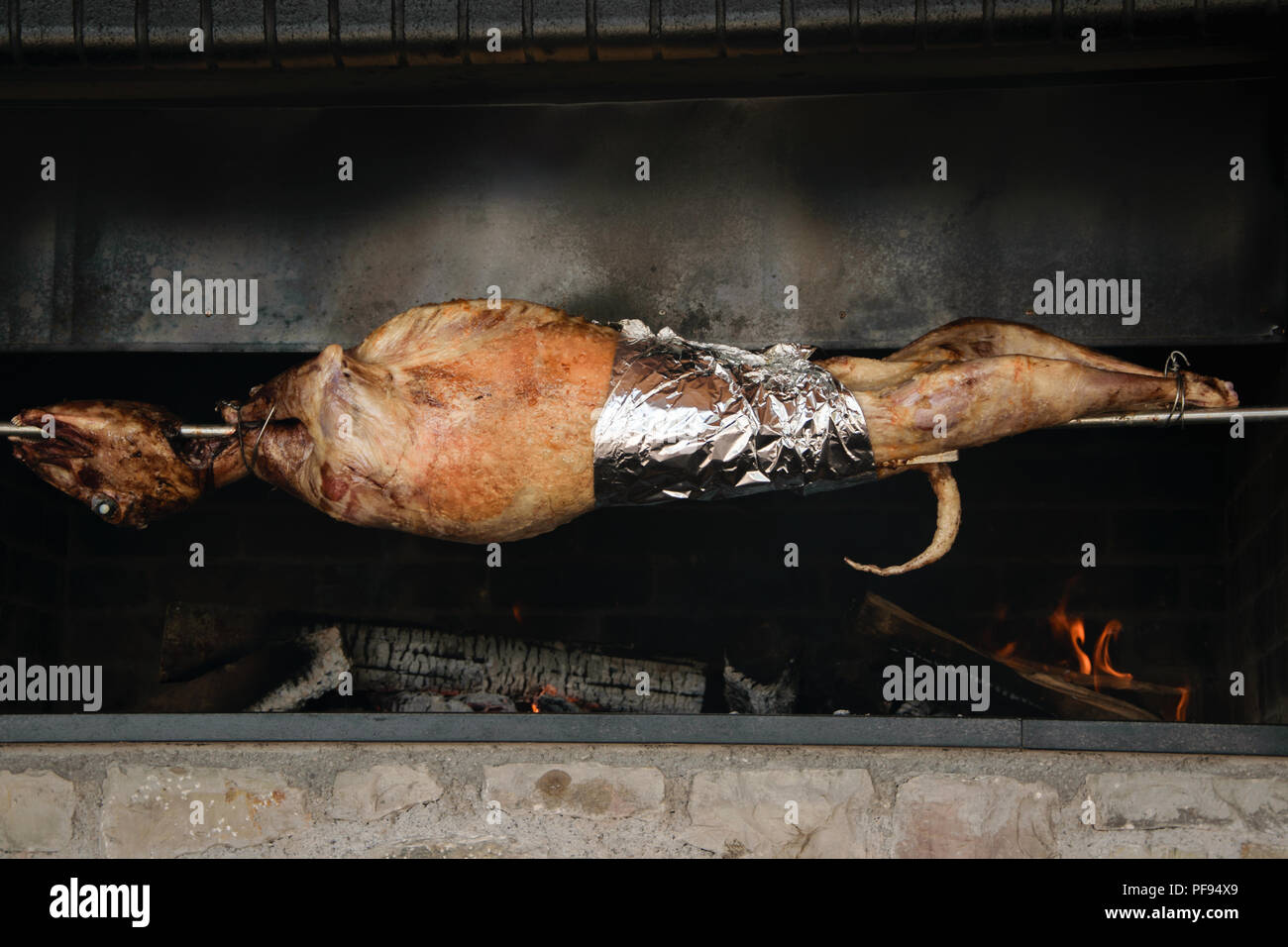 Traditional way of cooking a whole animal (lamb, goat) - roasting an ...