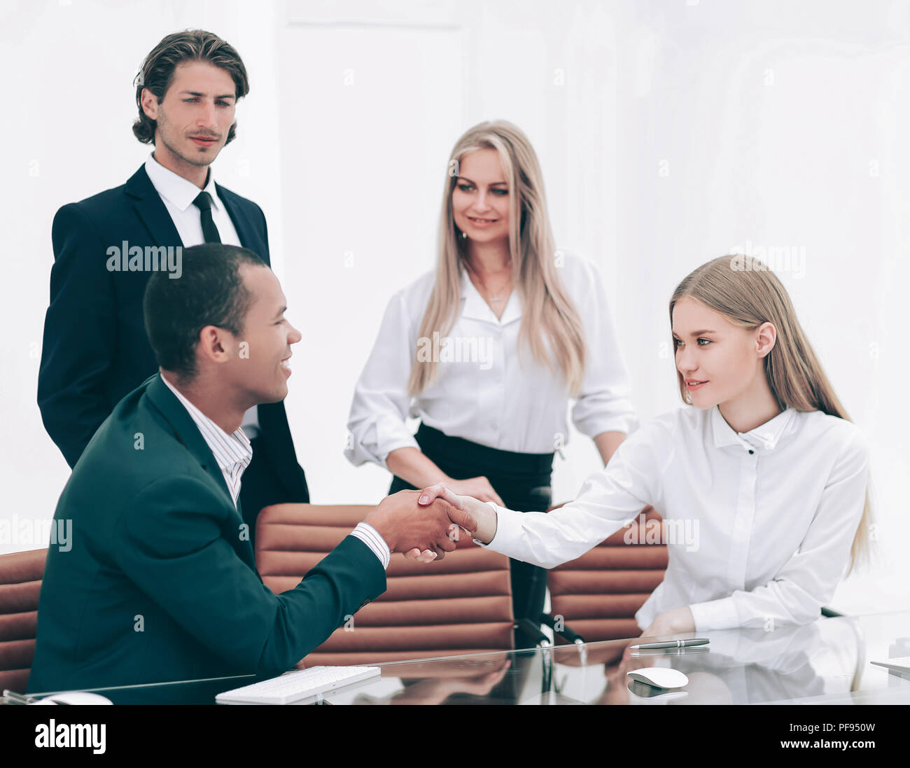 handshake Manager and the client in the office Stock Photo - Alamy