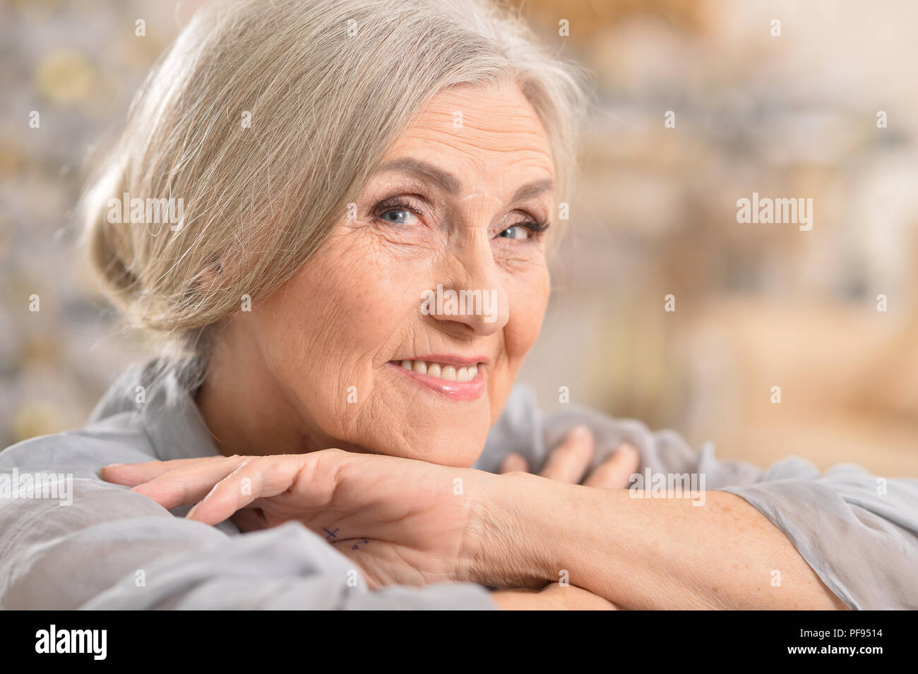 Portrait of a beautiful senior woman posing Stock Photo - Alamy