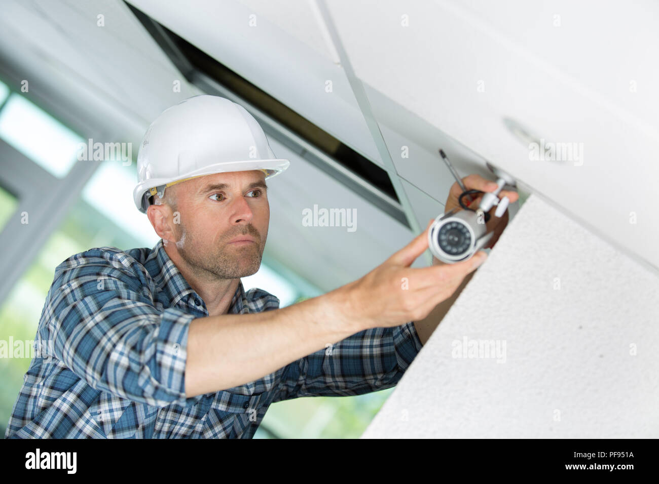 professional cctv technician working Stock Photo - Alamy