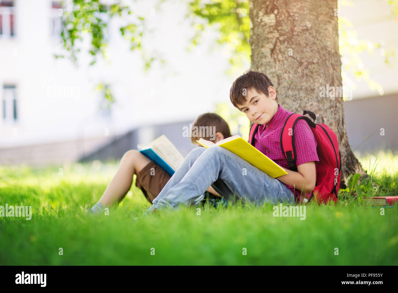 Children outside school building backpack hi-res stock photography and ...