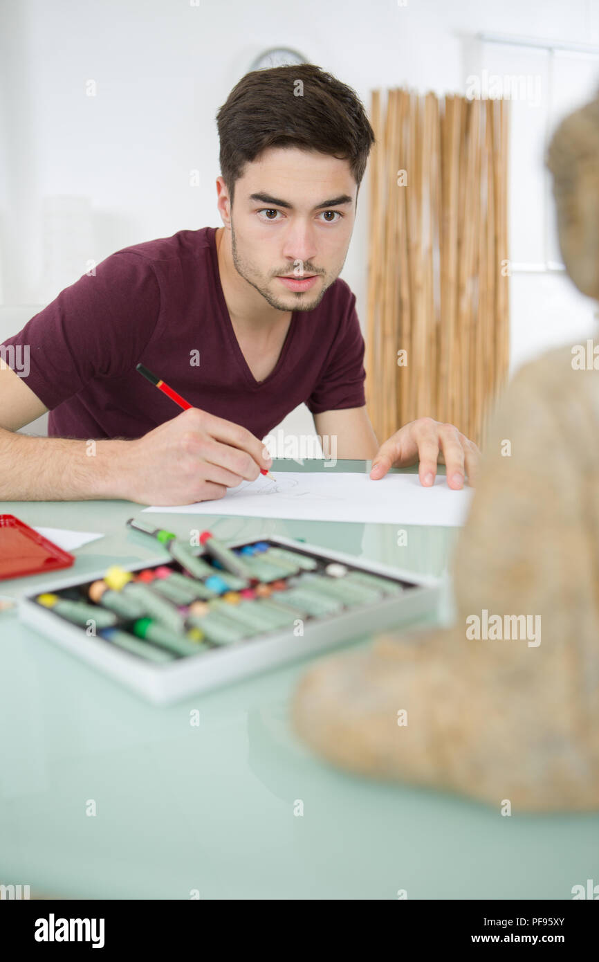 young artist practicing his painting techniques Stock Photo - Alamy