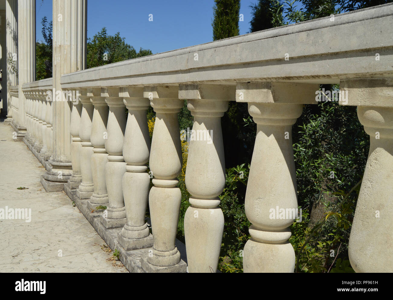 Close-up details of the balustrade, white marble columns, illuminated ...