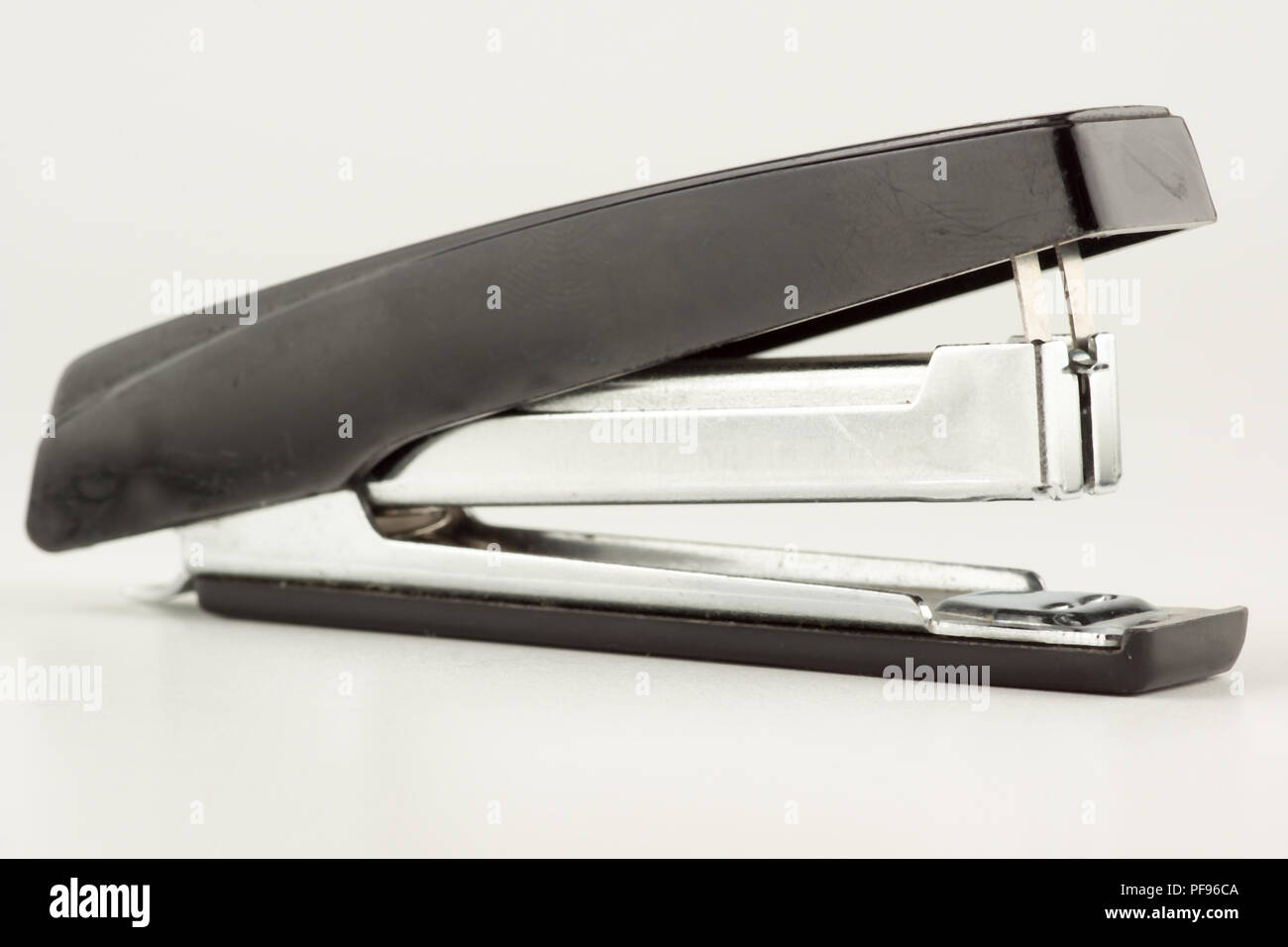 new stapler for stapling papers on a table Stock Photo - Alamy