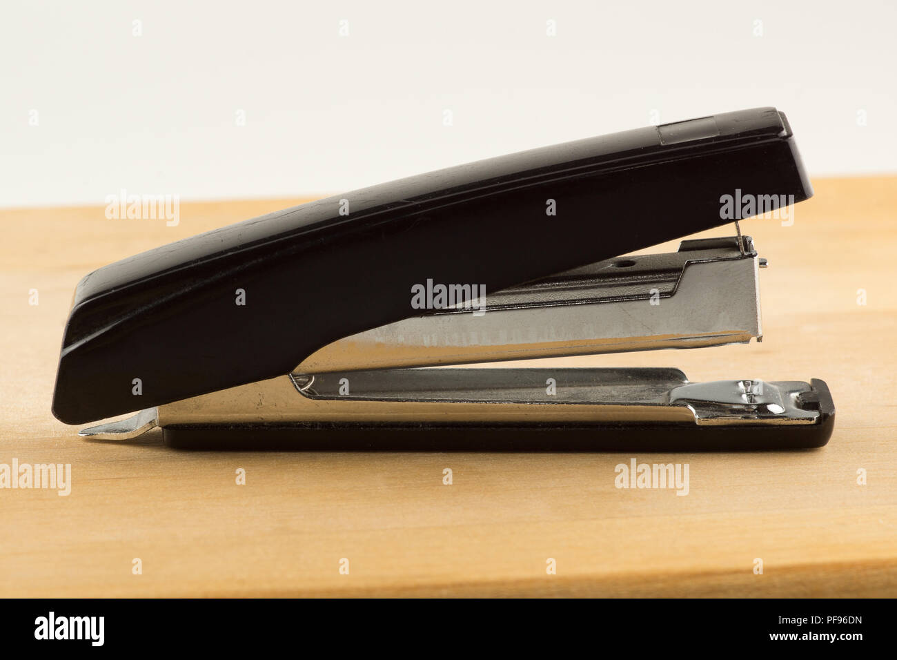 new stapler for stapling papers on a table Stock Photo - Alamy