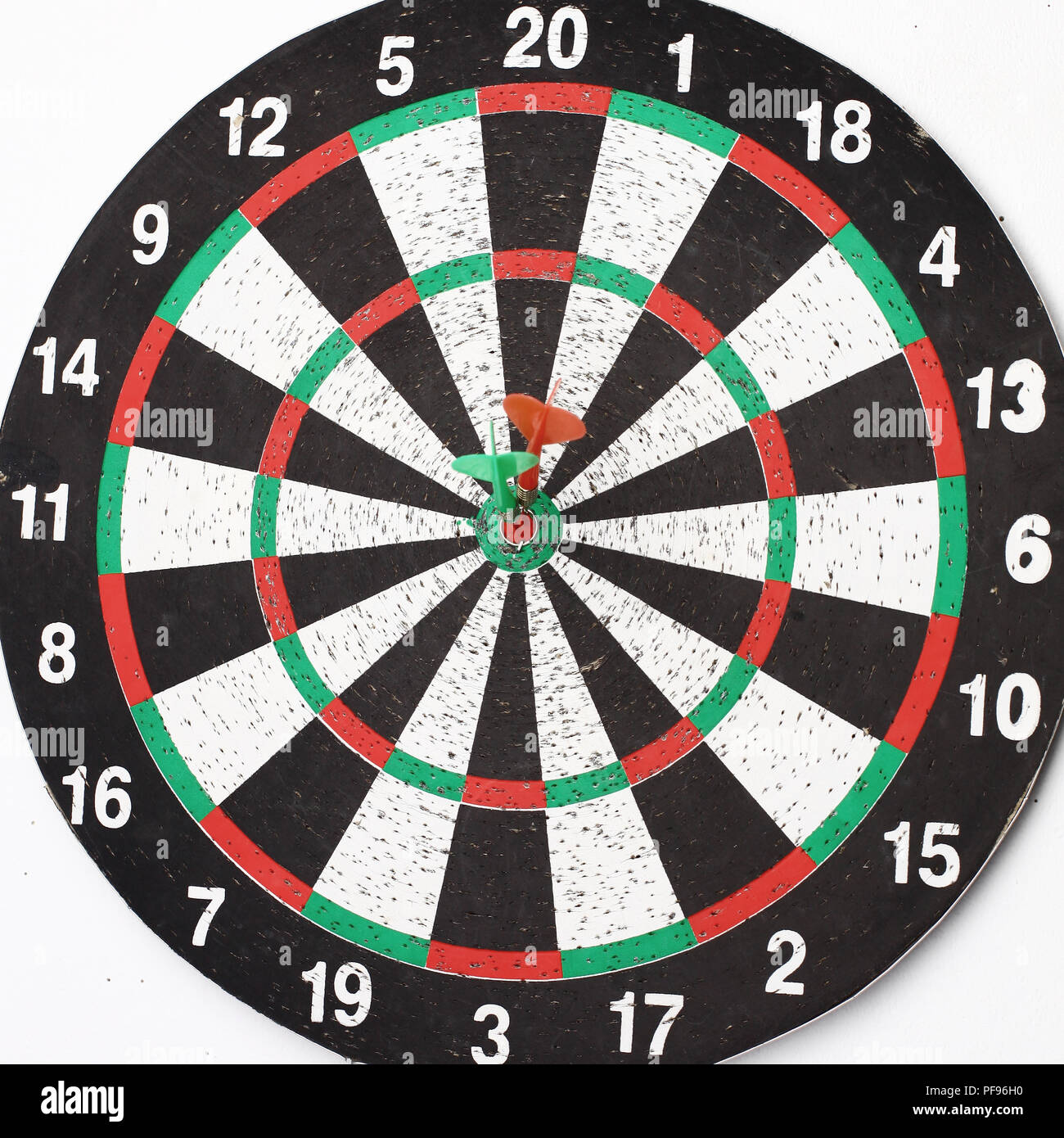 side view.Arrow dart hitting the center of the target dart Board Stock ...