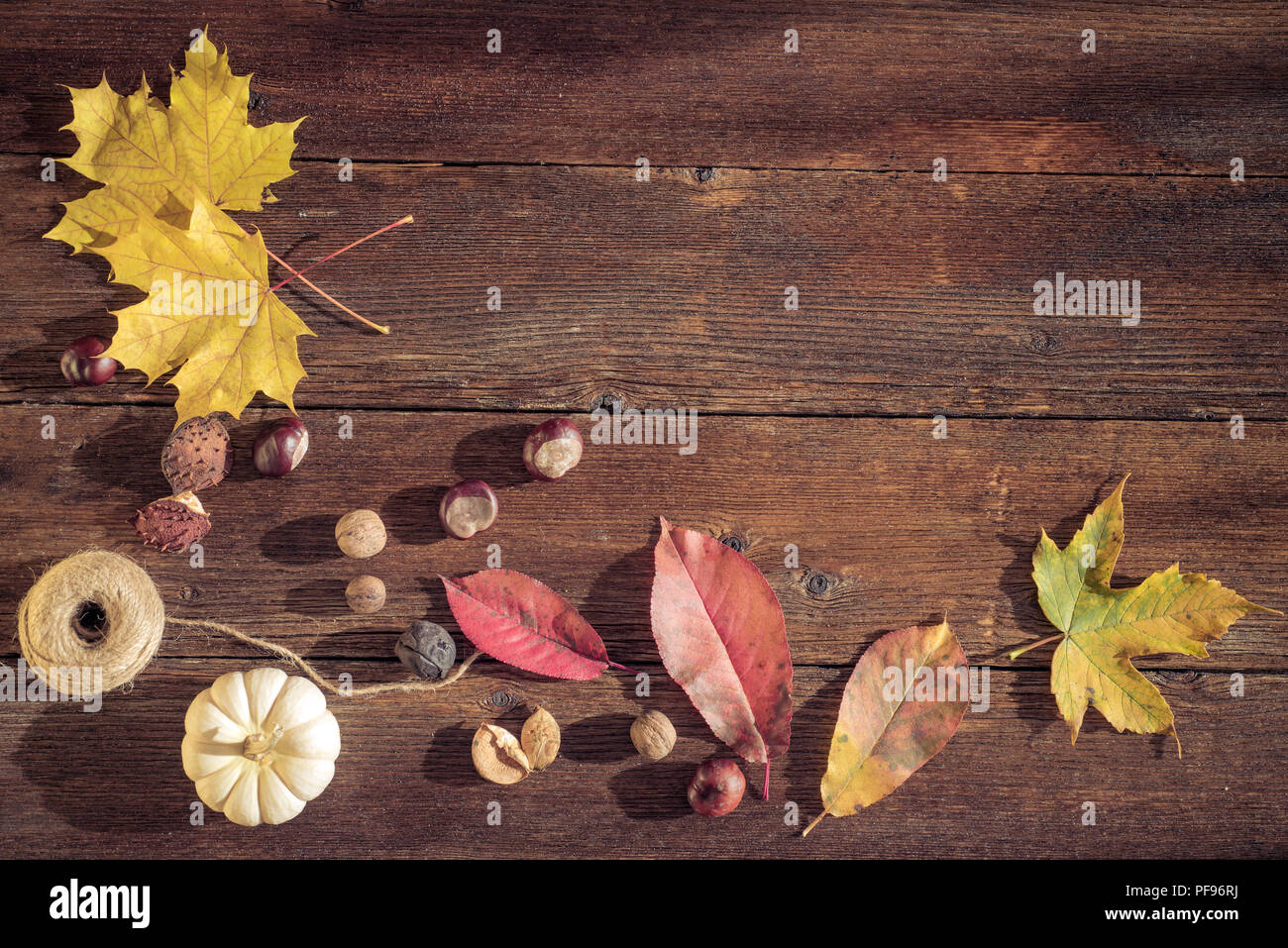 Autumn still life concept background. Fall leaves, harvest goodies on ...