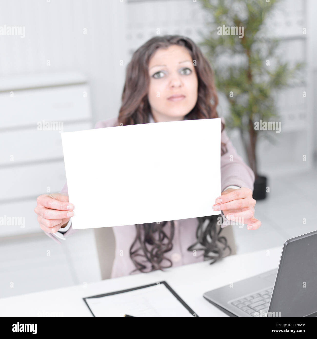 young business woman showing poster that says help Stock Photo - Alamy