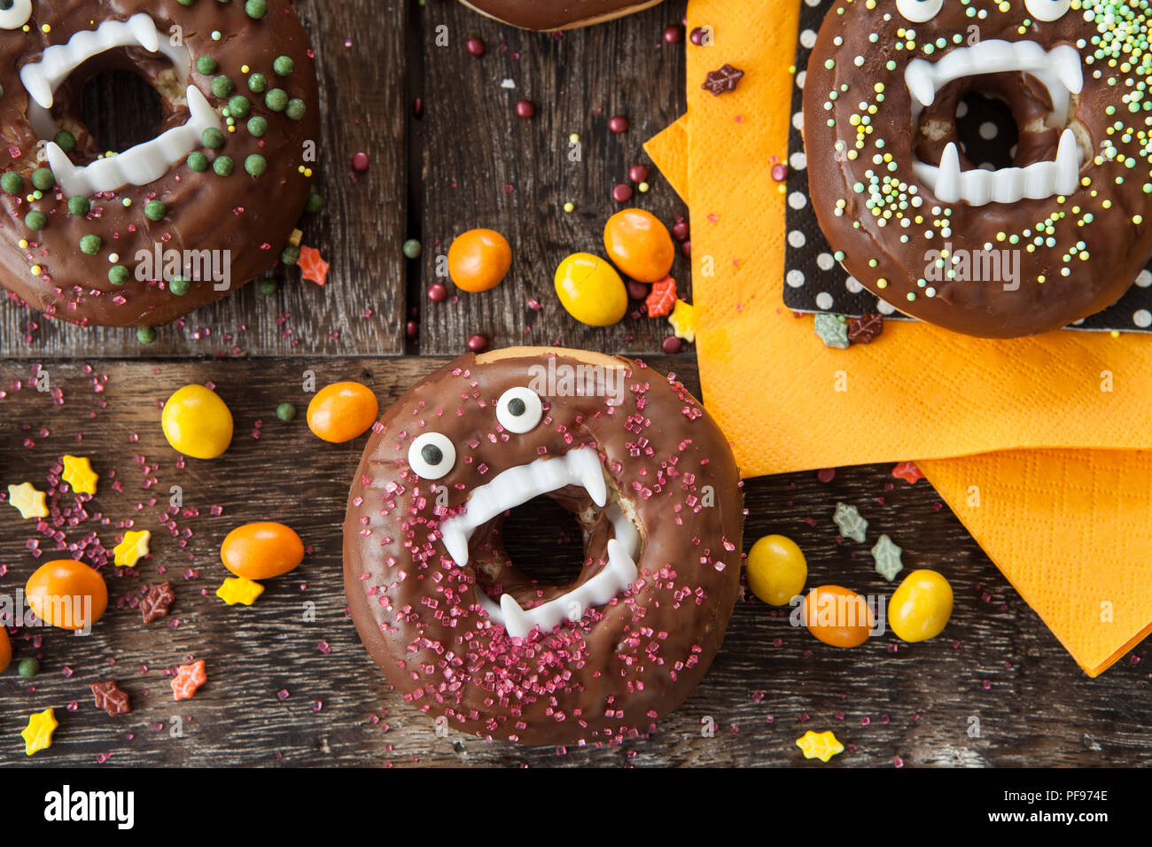 Scary Halloween donuts with chocolate frosting and sugar sprinkles ...