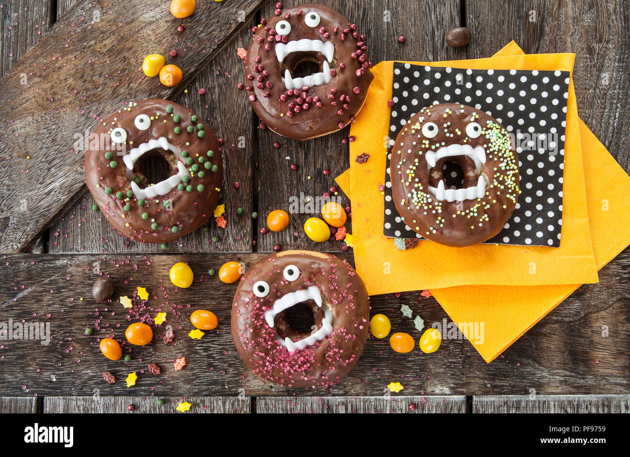 Scary Halloween donuts with chocolate frosting and sugar sprinkles ...