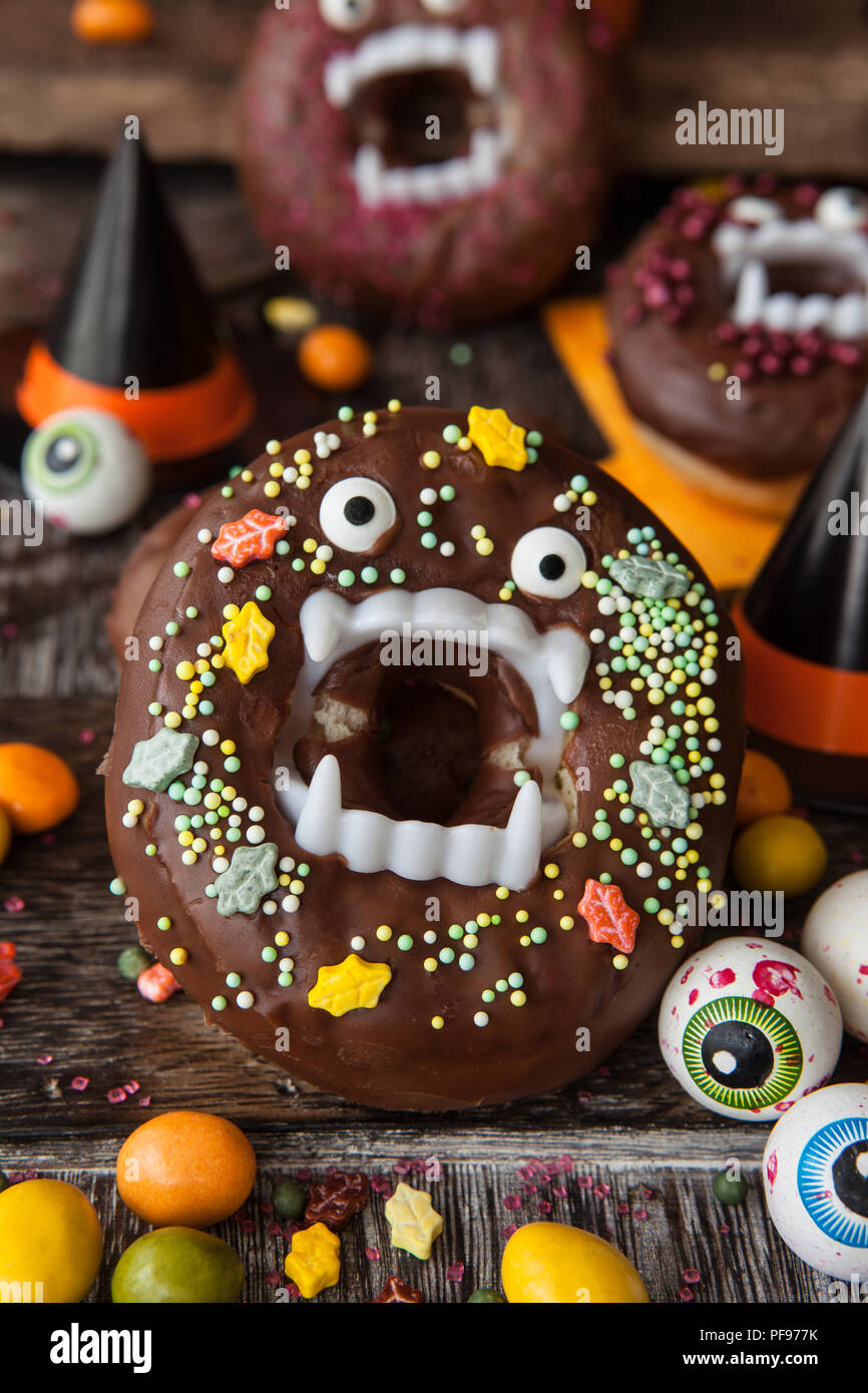 Scary Halloween donuts with chocolate frosting and sugar sprinkles ...