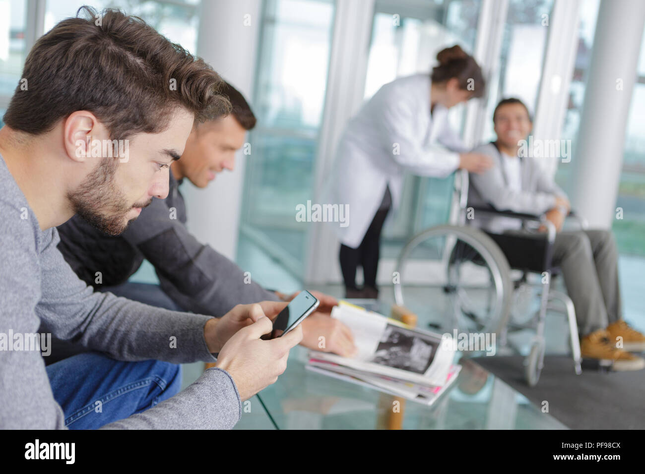 patients in doctors waiting room Stock Photo - Alamy