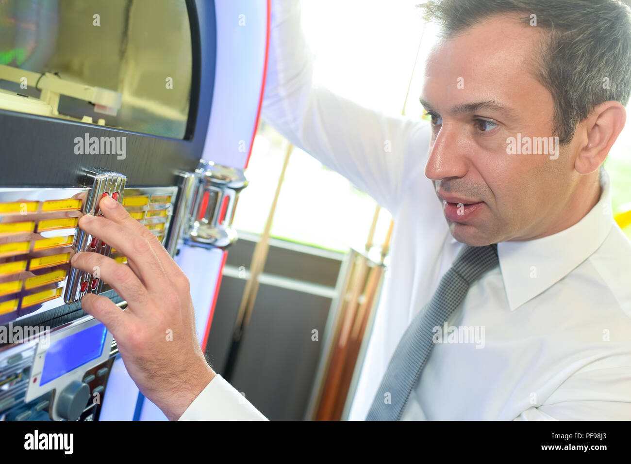 man at the jukebox Stock Photo - Alamy
