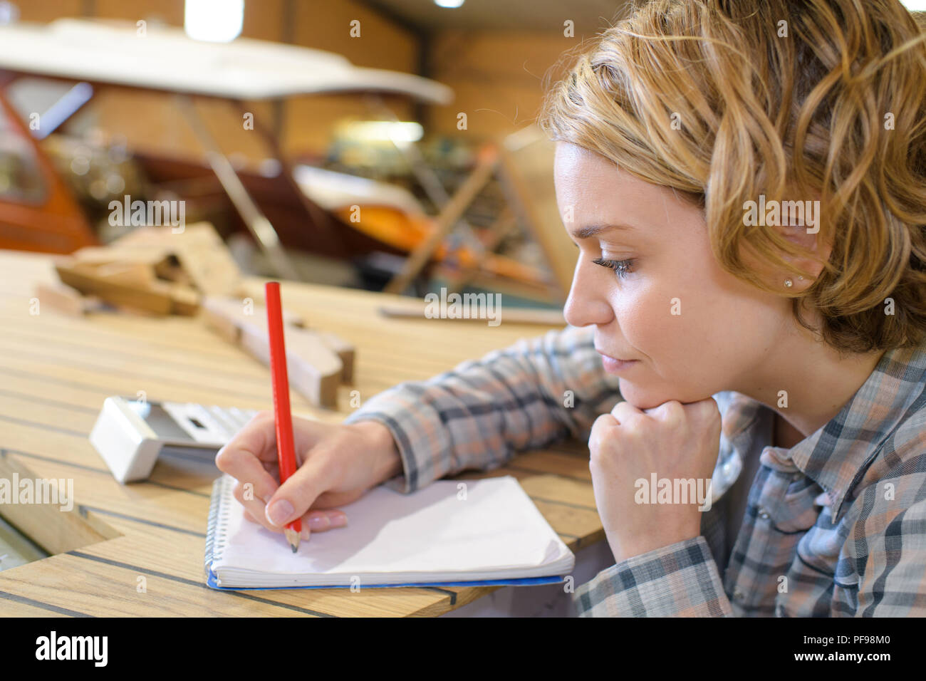 Female carpenter taking notes hi-res stock photography and images - Alamy