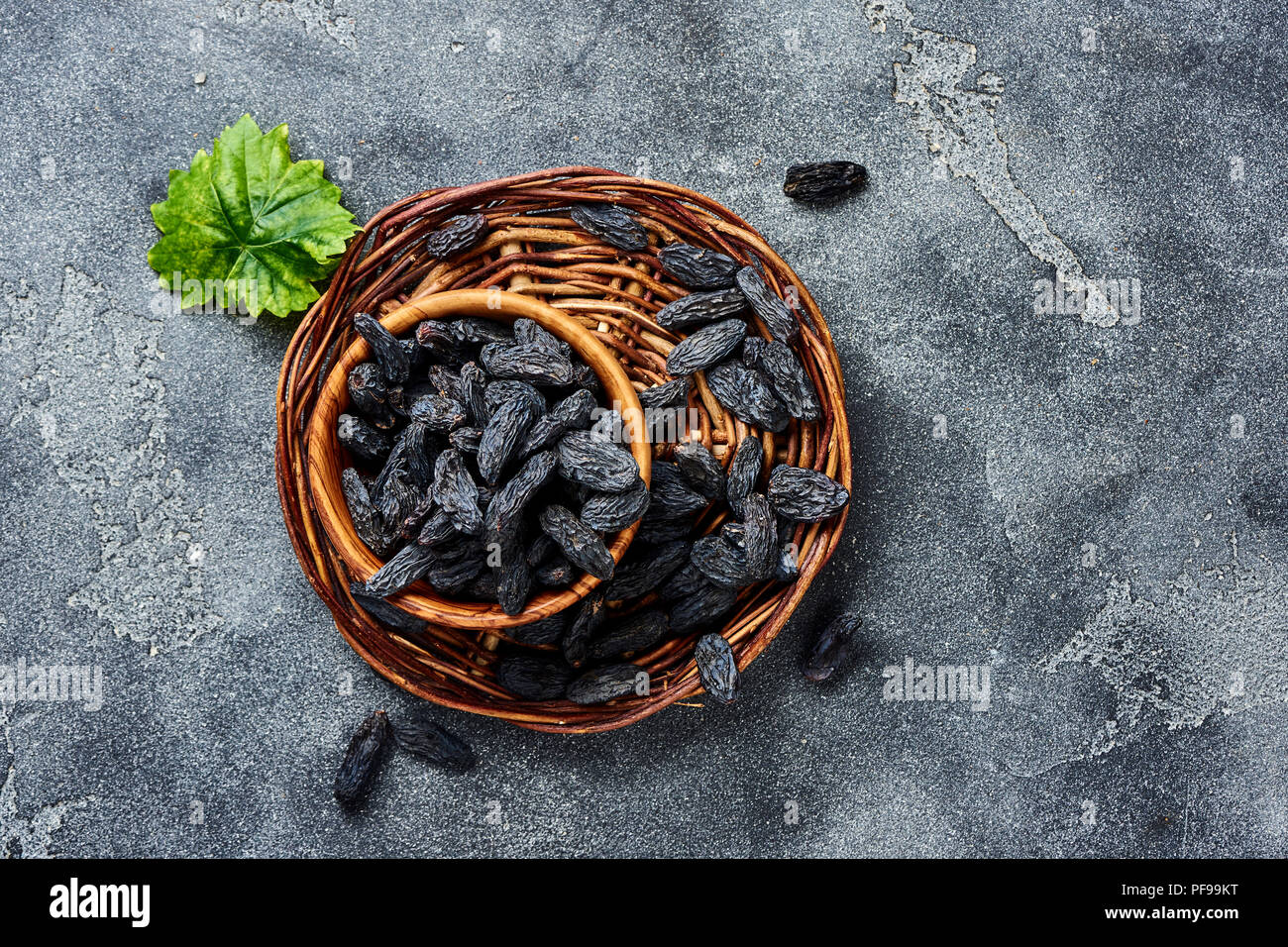 Black raisins on plate. Top view of dried grapes Stock Photo - Alamy