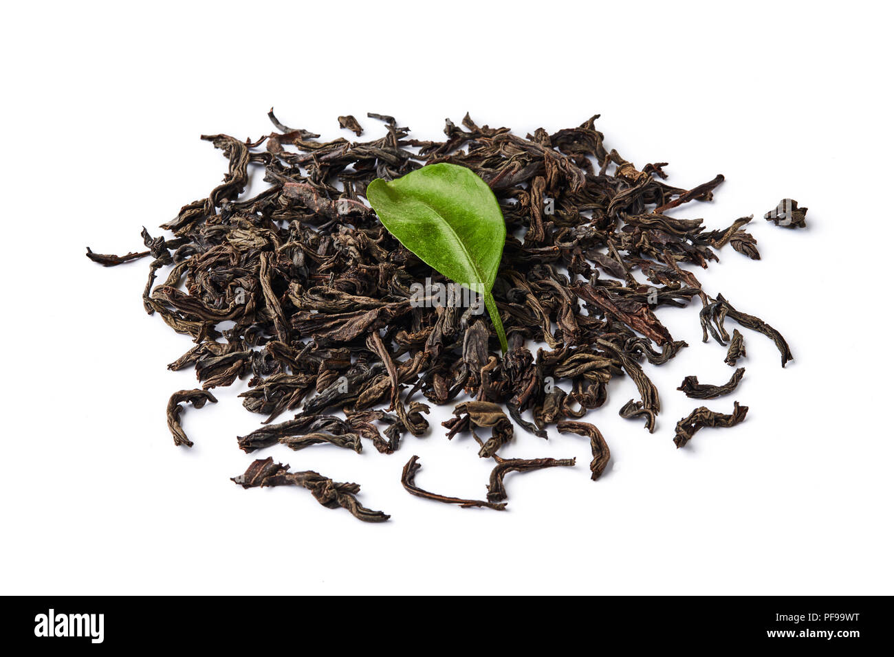 Heap of dried black tea leaves isolated on white background Stock Photo ...