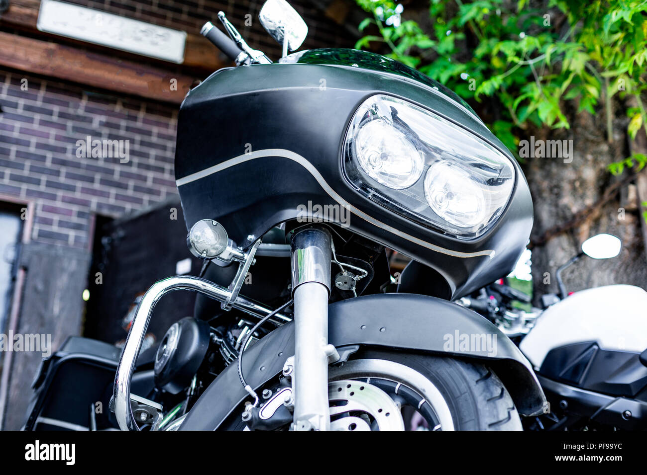 Vintage motorcycle parking on the road. Side view, close up Stock Photo ...