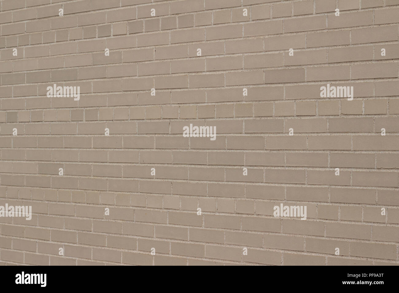 Attractive weathered light grey or beige brick wall background with a ...